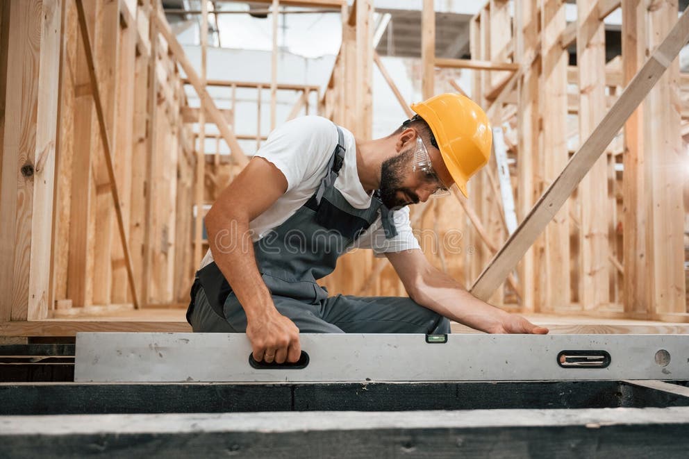 Checking the Straight by Using Leveling Tool. Industrial Worker in ...