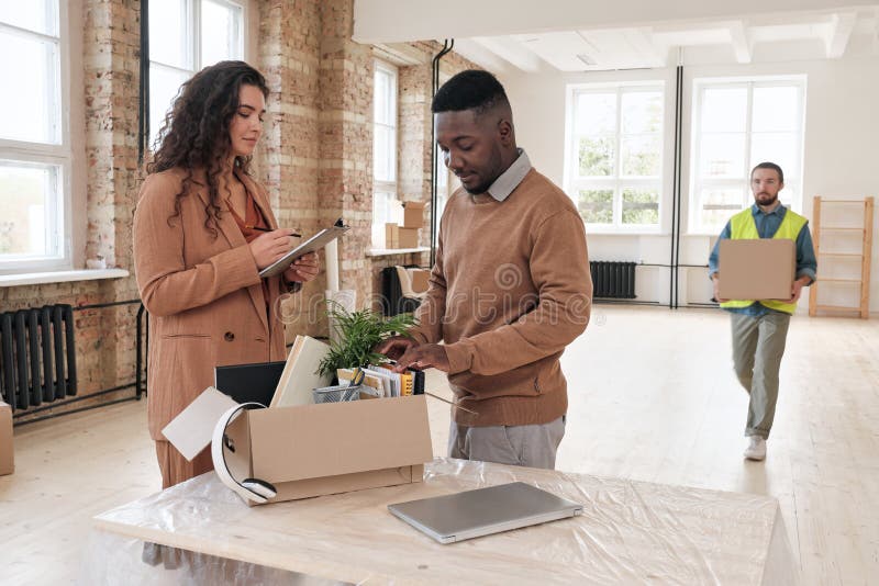 Checking Stuff List while Unpacking Moving Boxes Stock Photo - Image of ...