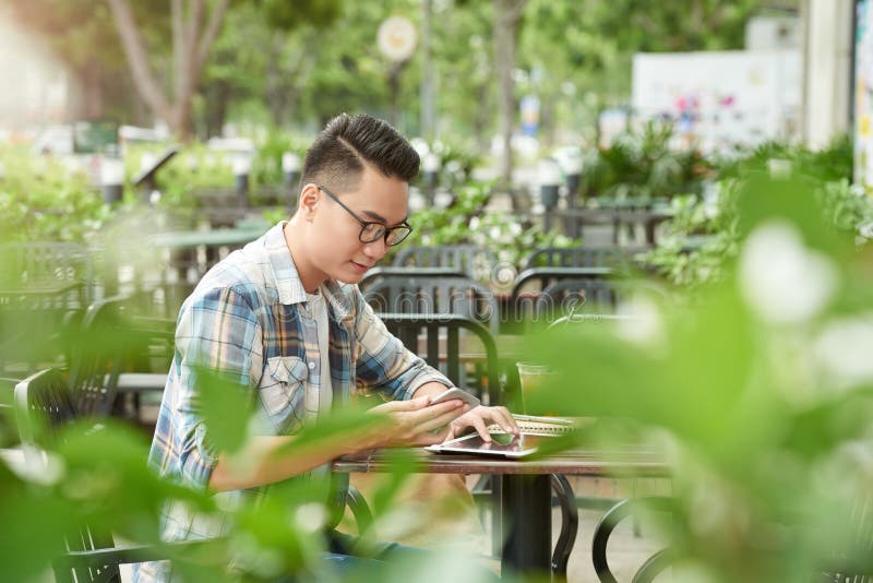 Checking text messages stock photo. Image of tablet - 102566344