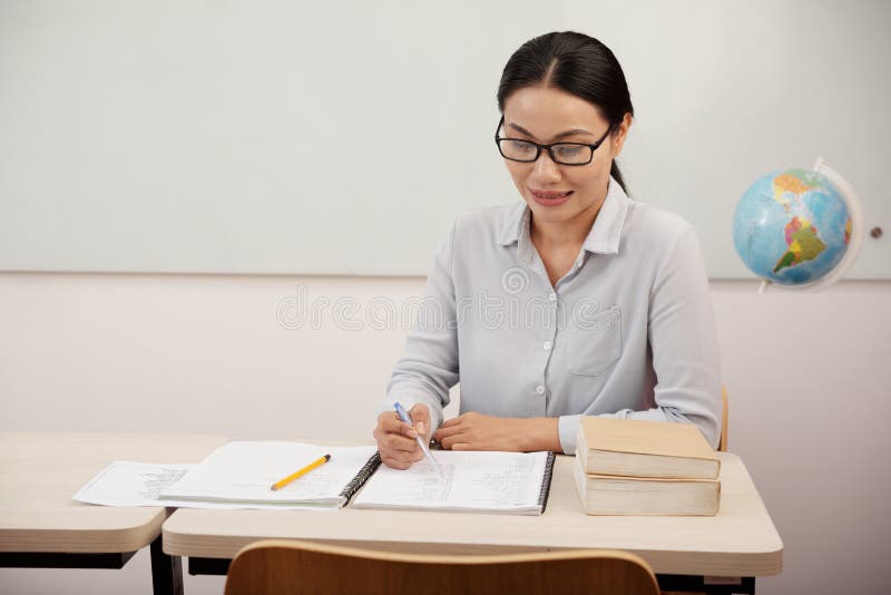 Checking textbook stock image. Image of office, teacher - 119980933