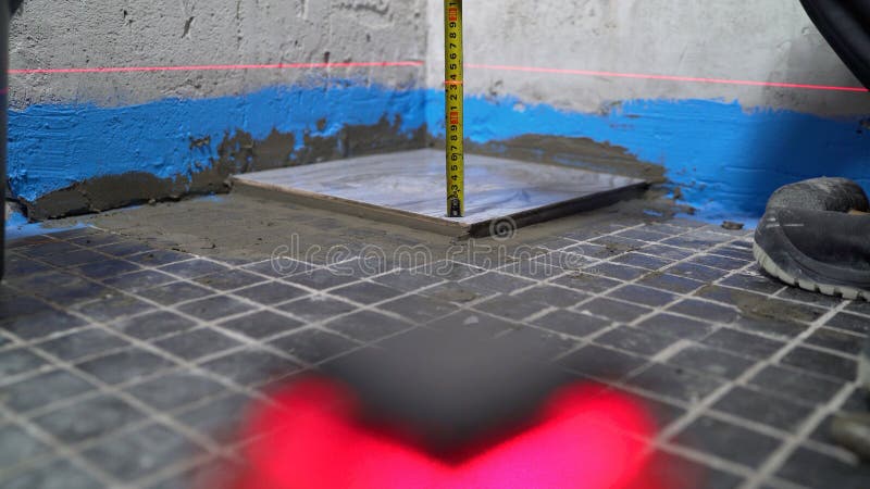 Checking the Tiles in the Bathroom. Quality Control when Laying Ceramic ...