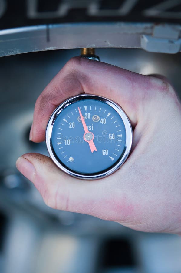 Mechanic Checking Tire Preasure Stock Photo - Image of tire, preasure ...