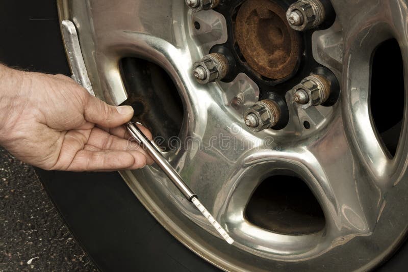 Checking tire pressure stock image. Image of pounds, valve - 22353543