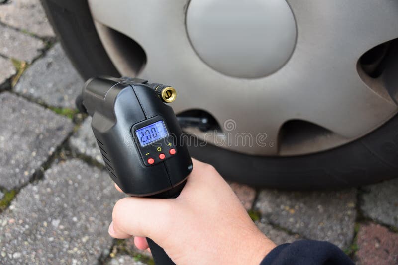 Checking Tire Pressure / Inflate Car Tire Stock Photo - Image of tyre ...
