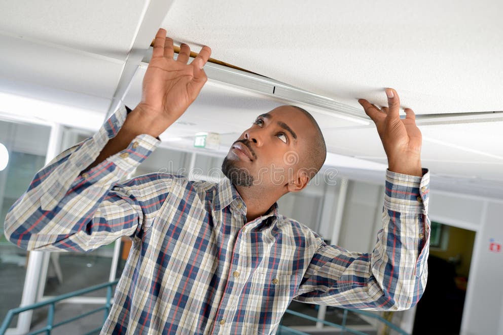 Checking Under Ceiling Panel Stock Image - Image of tools, inspecting ...