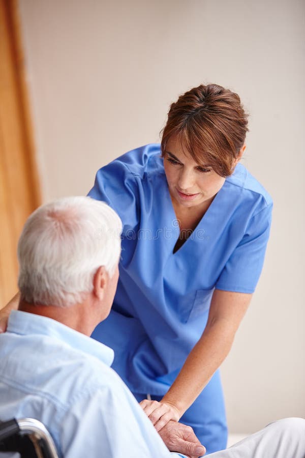 Checking Up on Her Patient. a Female Nurse Checking on Her Senior ...