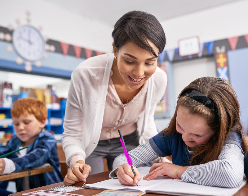 Checking Up on Her Scholars. Elementary School Children in Class. Stock ...