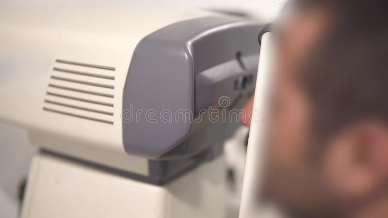 Checking Vision with Optician Machine, Loop-ready Stock Video - Video ...
