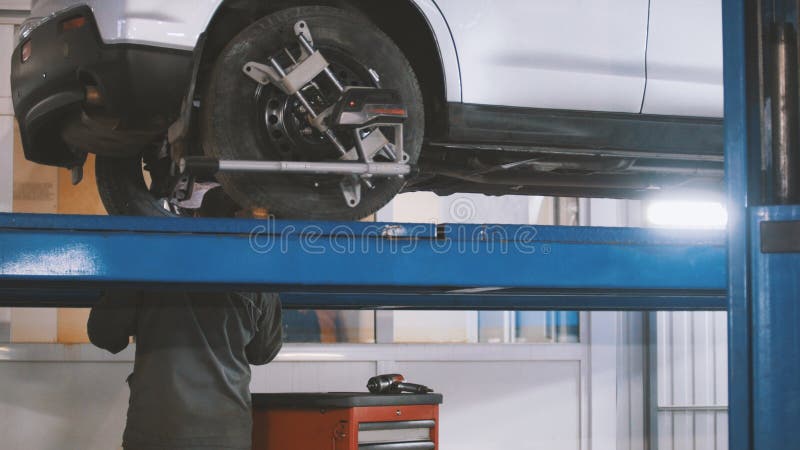 Checking the Wheel in Garage Automobile Service, Close Up Stock Photo ...