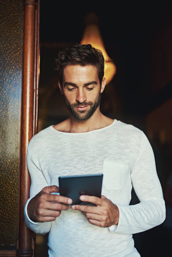 Checking in with the World Wide Web. a Handsome Man Using a Digital ...