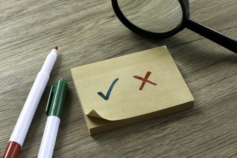 Checklist with Green Check Mark and Red Cross on Sticky Note with Pens ...