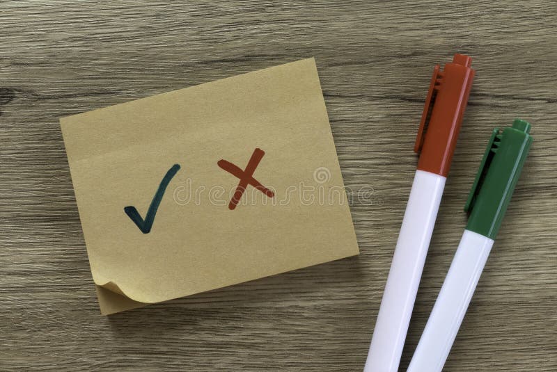 Checklist with Green Check Mark and Red Cross on Sticky Note with Pens ...