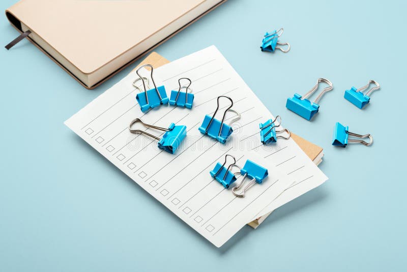 Checklist Paper with Binder Clips on Office Table Background Stock ...