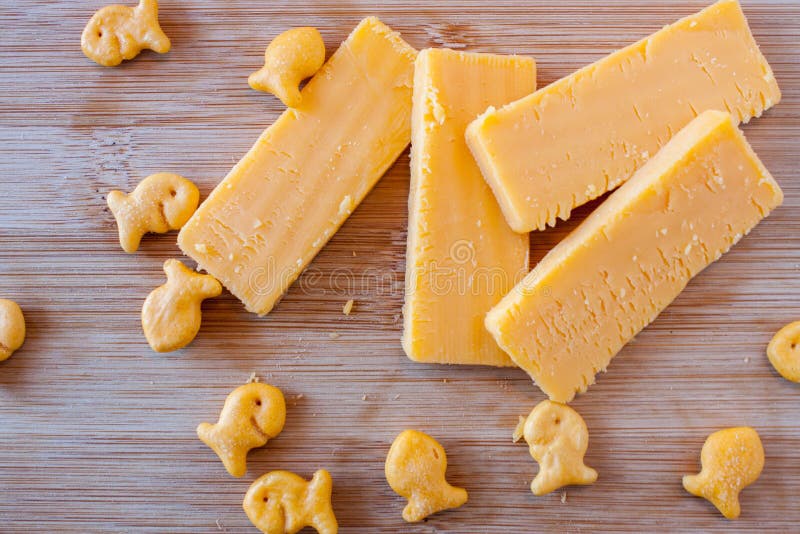 Cheddar Cheese Block and Slices Stock Photo - Image of cube, fish: 35627904