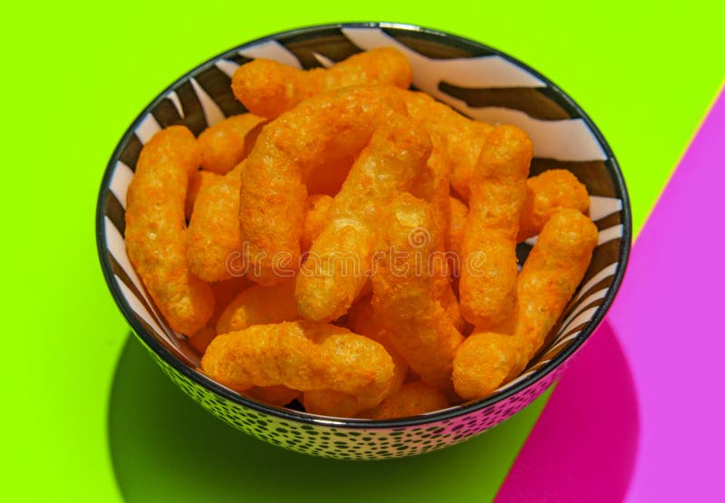 Cheddar Cheese Curls Snack stock image. Image of geometry - 226982873