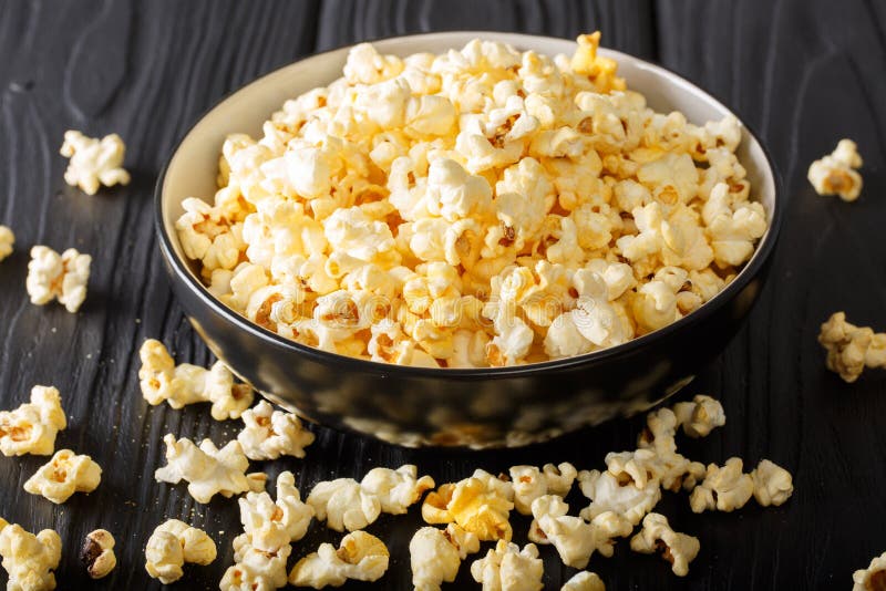 Cheddar Cheese Salted Popcorn Closeup in a Bowl on Table. Verti Stock ...