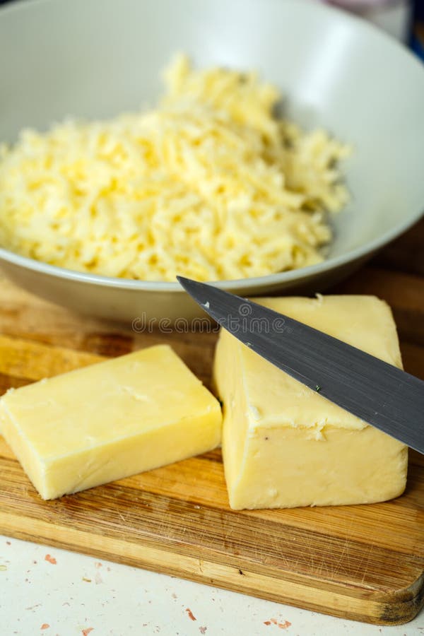 Cheddar Cheese Sliced and Shredded Stock Photo - Image of chopped ...