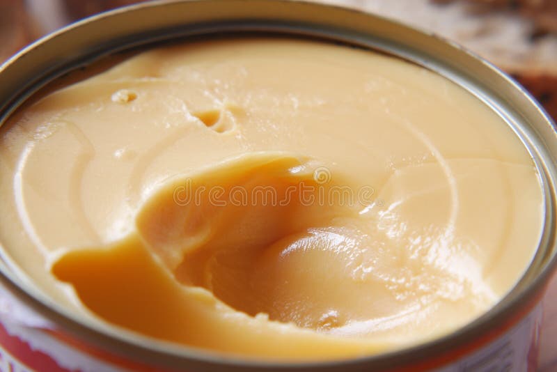 Cheddar Cheese in a Tin Container on Table Stock Photo - Image of ...