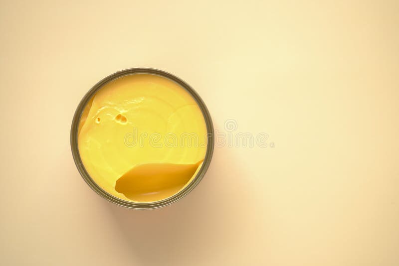 Cheddar Cheese in a Tin Container on Table Stock Photo - Image of piece ...