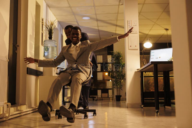 Cheeful Employees Having Fun in Startup Office during Work Break Stock ...