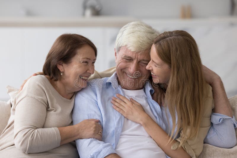 Cheerful Adult Woman Hugging Older Senior Parents Stock Image - Image ... Cheerful Adult Woman Hugging Older Senior Parents Stock Image - Image ...
