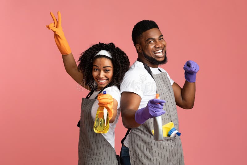 Cheerful African American Couple With Spray Detergents Posing On Pink