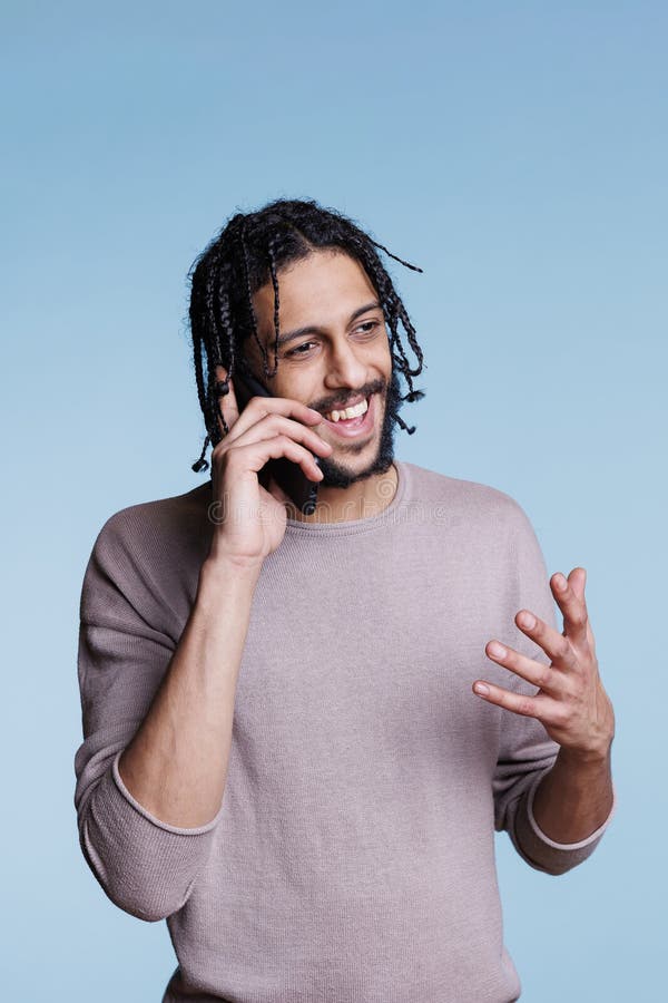 Cheerful Arab Man Having Fun Conversation on Smartphone Stock Photo ...