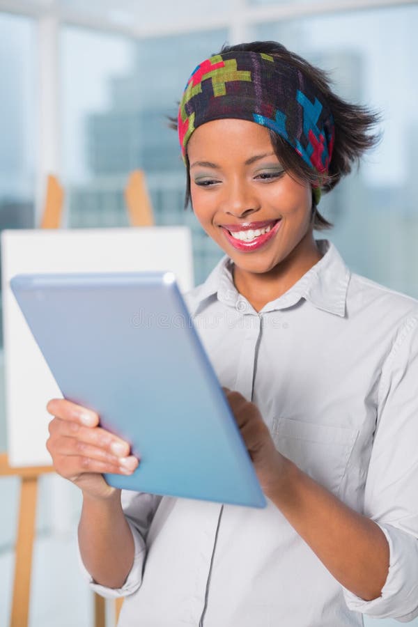 Cheerful Artist Using Tablet Stock Photo - Image of hairband ...