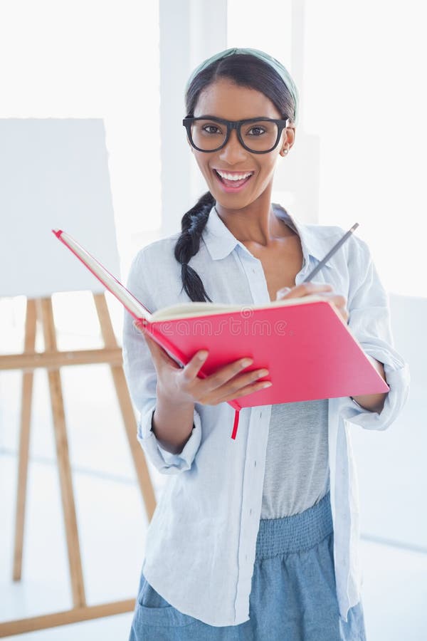 Cheerful Attractive Artist Writing on Her Notebook Stock Image - Image ...