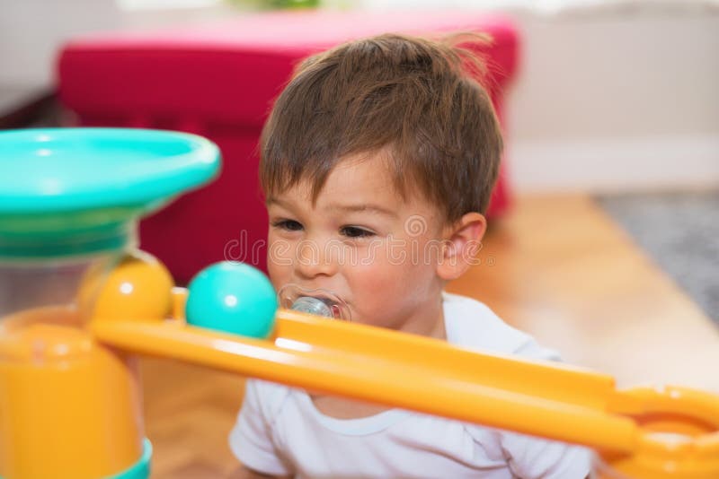 Cheerful Baby Playing in the Nursery Stock Image - Image of education ...