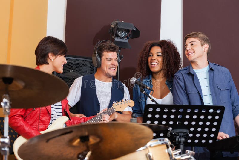 Cheerful Band Members Performing Together Stock Photo - Image of male ...