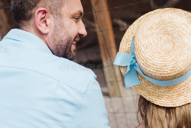Cheerful Bearded Father Looking at Kid in Straw Hat. Stock Image ...