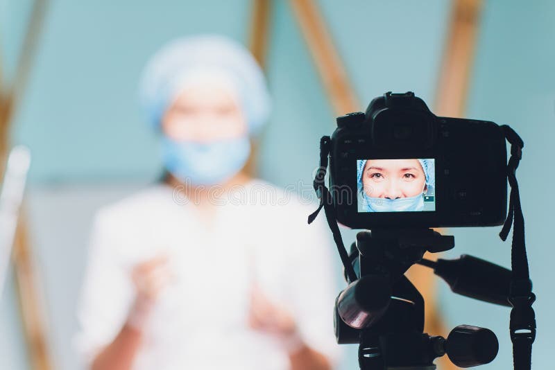 Cheerful Beautiful Woman Doctor Recording Vlog Video about Medicine and ... Cheerful Beautiful Woman Doctor Recording Vlog Video about Medicine and ...