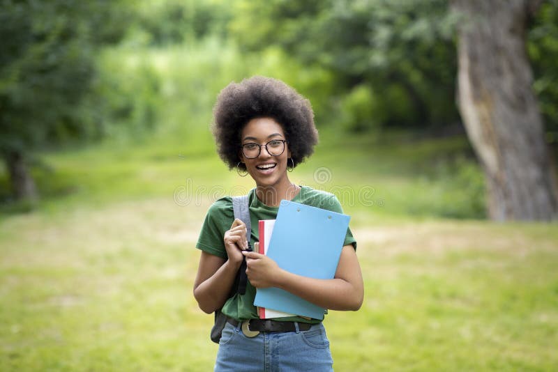Cheerful Black Female College Student with Backpack and Workbooks ...