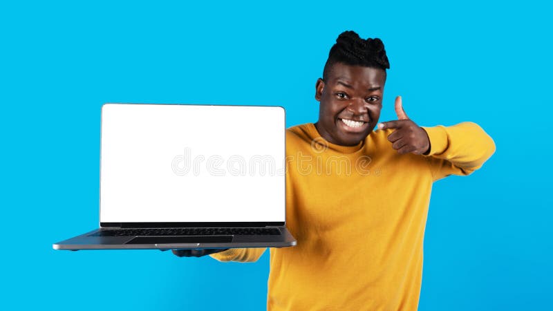Cheerful Black Guy Pointing at Laptop Computer with Blank White Screen ...