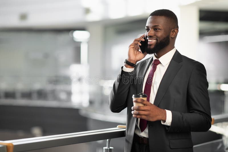 Cheerful Black Manager Drinking Coffee, Having Phone Conversation Stock ...