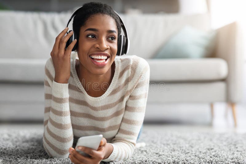 Cheerful Black Woman In Wireless Headphones Listening Music On