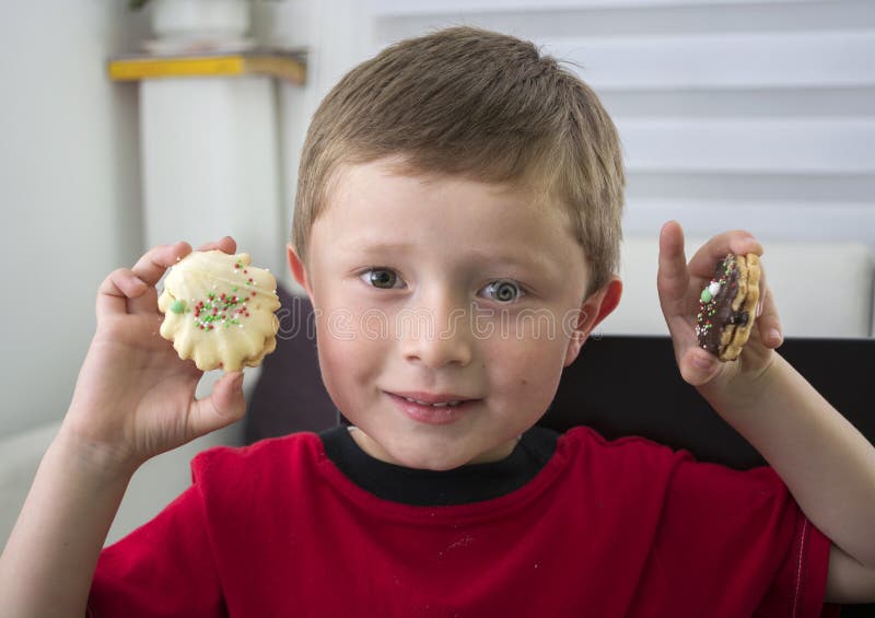 Cheerful Boy Offering You a Chocolate Cookie. Stock Photo - Image of ...