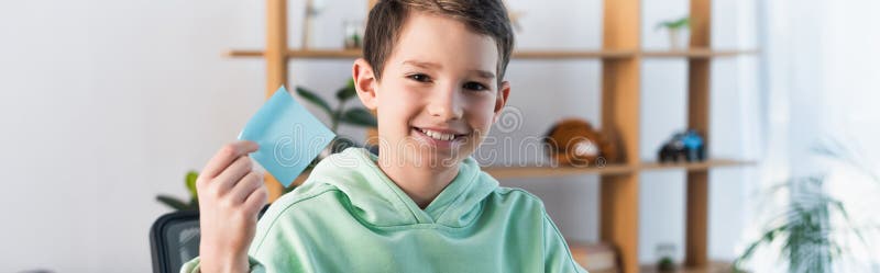 Cheerful Boy Showing Empty Sticky Note Stock Image - Image of texture ...