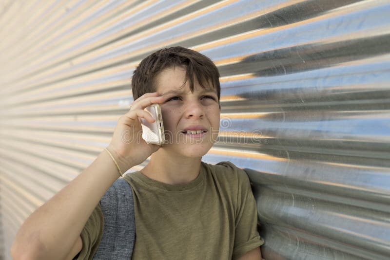 Cheerful Boy Using a Mobile Phone Stock Image - Image of school ...