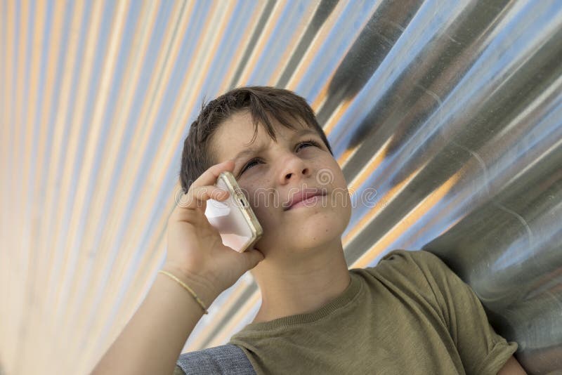 Cheerful Boy Using a Mobile Phone Stock Photo - Image of happy, mobile ...