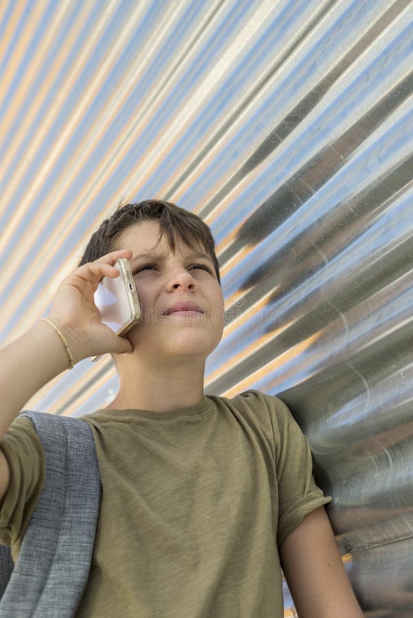 Cheerful Boy Using a Mobile Phone Stock Photo - Image of schoolchild ...