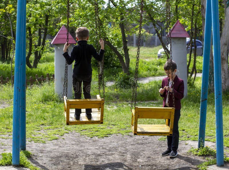 Cheerful Boys Ride on Swing Stock Image - Image of friend, person ...