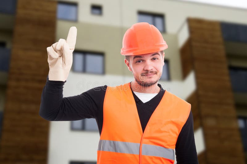 Cheerful Builder Pointing Up His Finger Stock Photo - Image of building ...