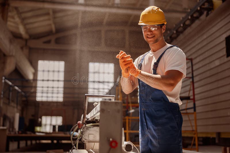 Cheerful Builder Using Woodworking Machine in Workshop Stock Image ...