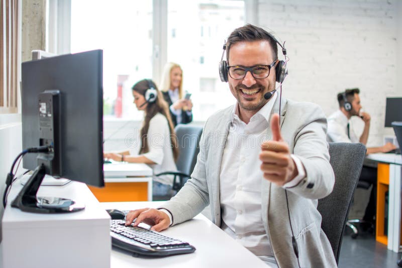 Cheerful Business Man with Headset Showing Thumb Up while Working on ...