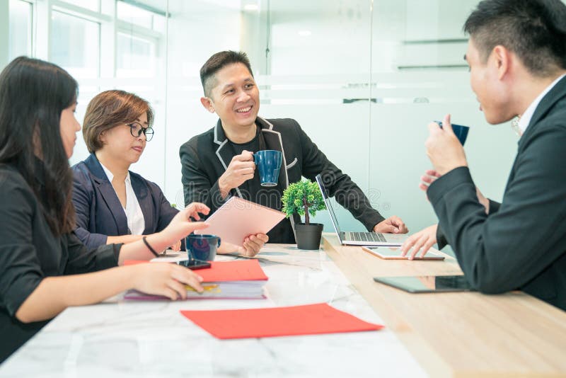 Cheerful Business Office Workers Discussing Project Over Cup of Coffee ...