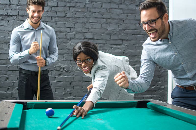 Cheerful Business People Playing Billiards during Office Break Stock ...
