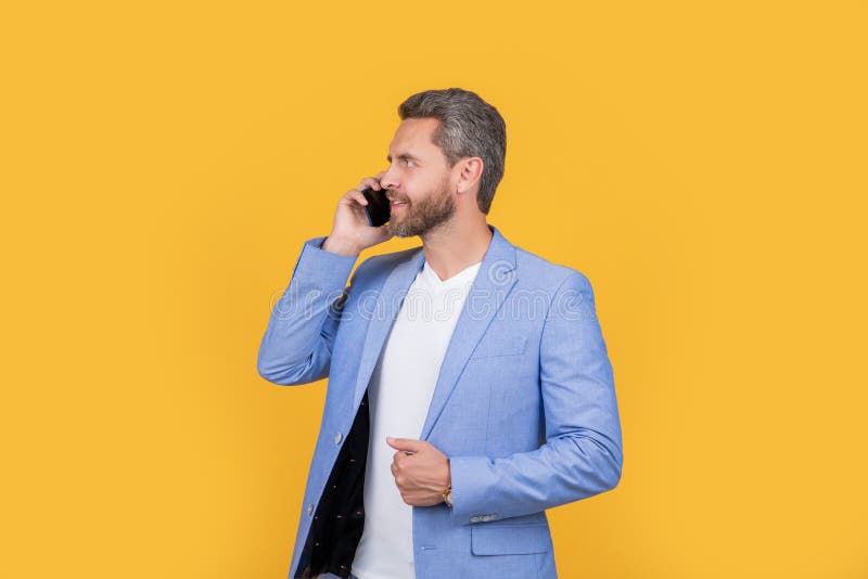 Cheerful Businessman Speak on Phone in Studio. Businessman Speak on ...