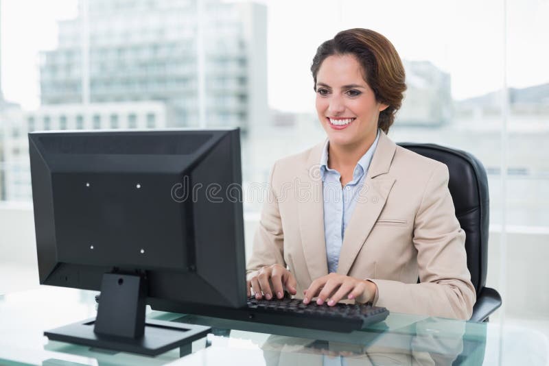 Cheerful Businesswoman Sitting in Front of Computer Stock Image - Image ...